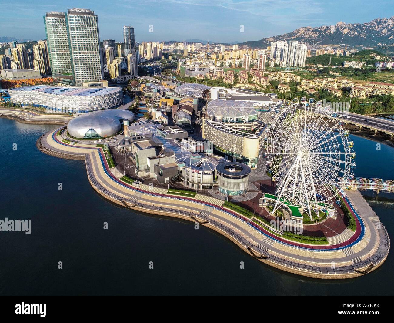 An aerial view of an ocean-view Ferris wheel in the Qingdao West Coast ...