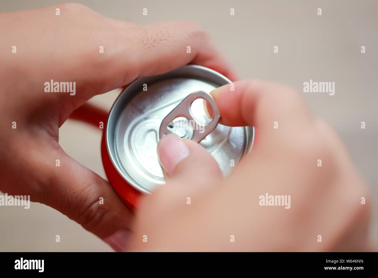 Closeup hands holding can hi-res stock photography and images - Alamy