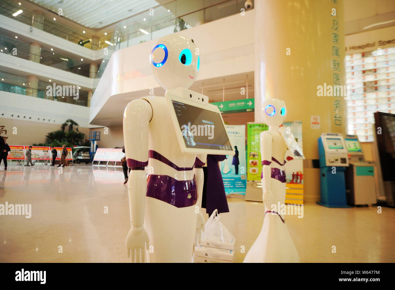 Robot receptionists serve patients in the outpatient hall at Chinese ...