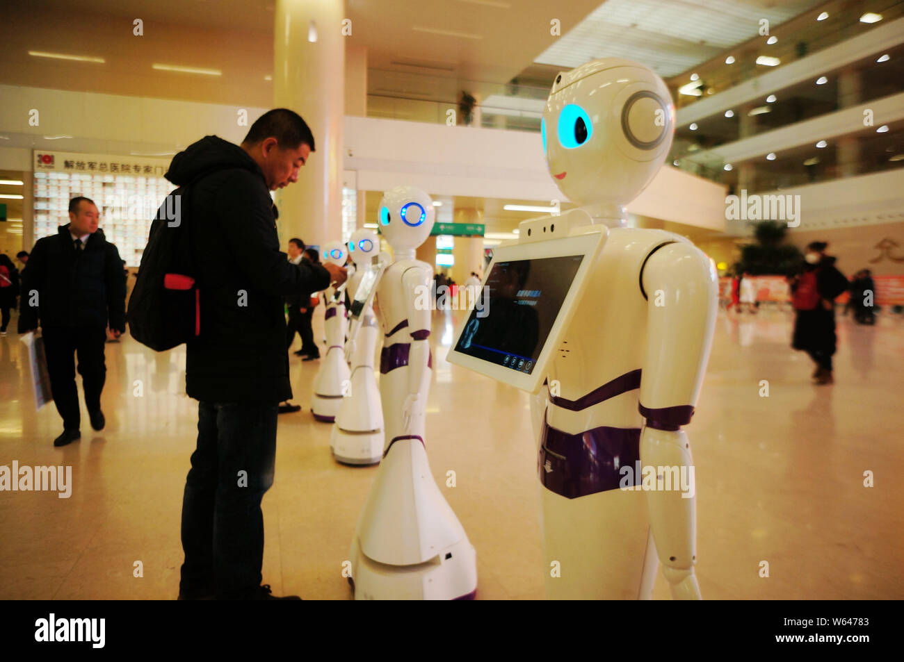 Robot receptionists serve patients in the outpatient hall at Chinese ...