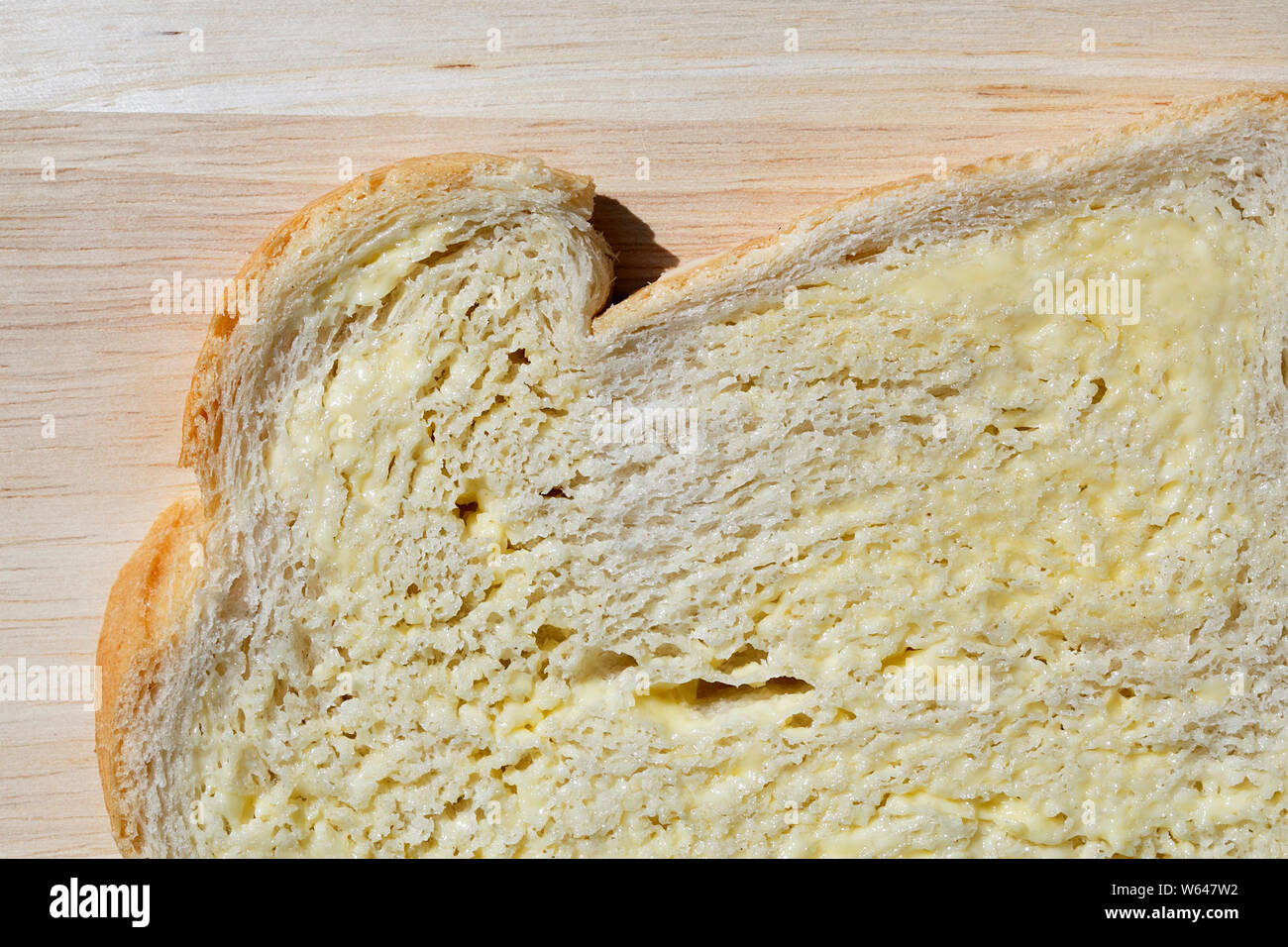 One slice of white bread spread with butter - directly above Stock ...