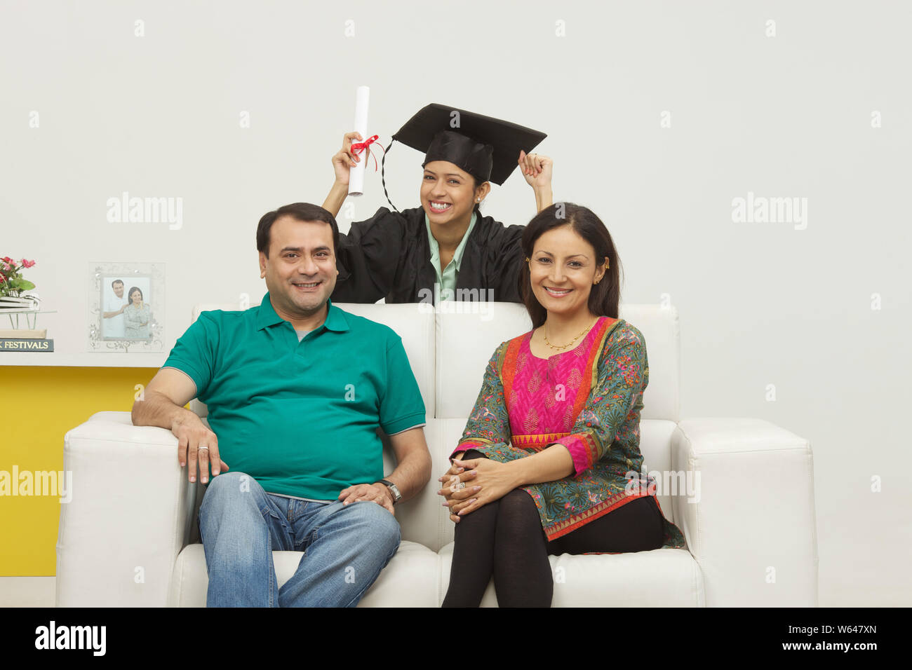 Graduate student with her parents at home Stock Photo - Alamy
