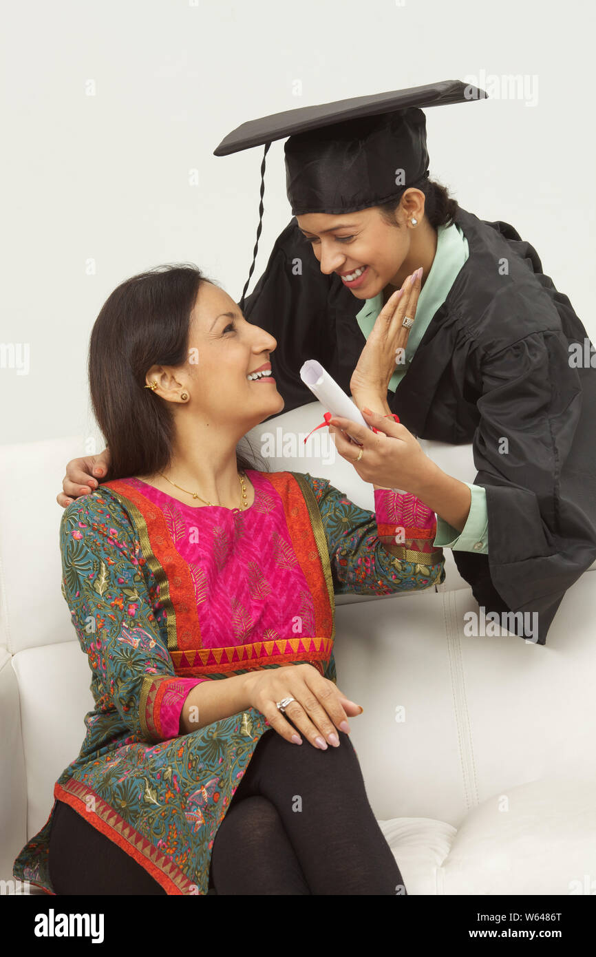 College girl celebrating graduation with her mother Stock Photo - Alamy