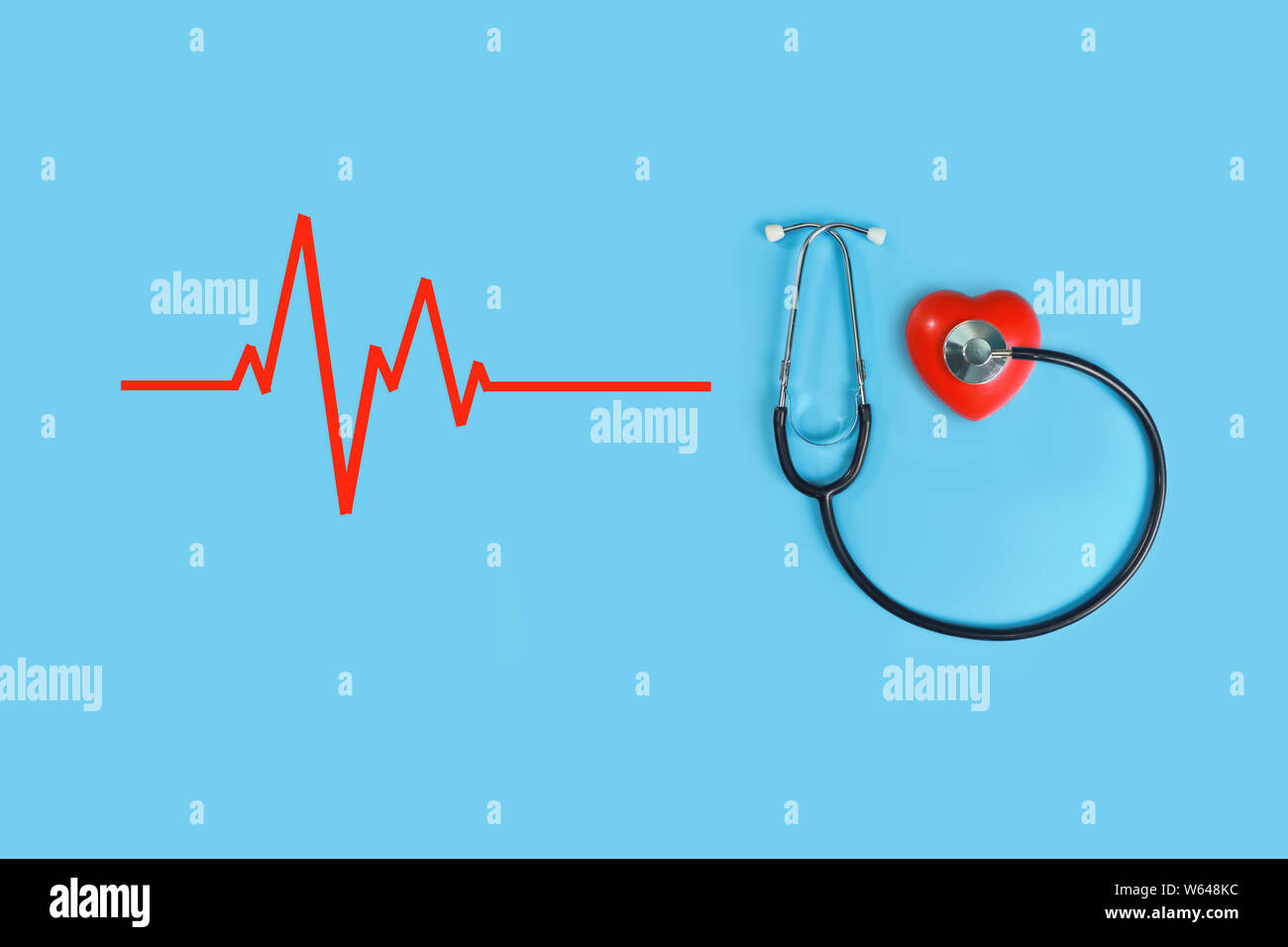 stethoscope and red heart symbol with heartbeat cardiogram line on blue ...