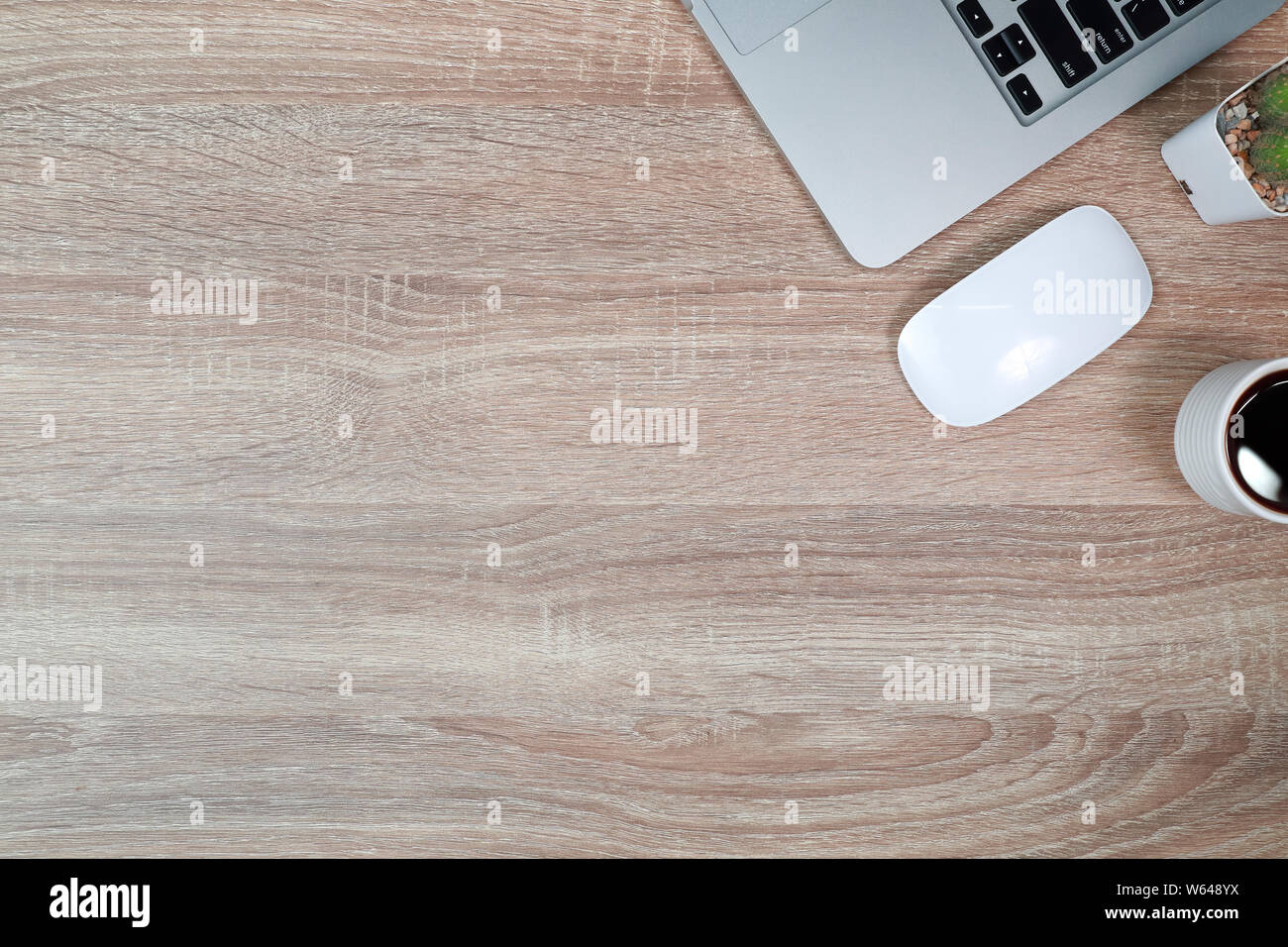 technology working wood table with laptop computer, coffee cup and ...