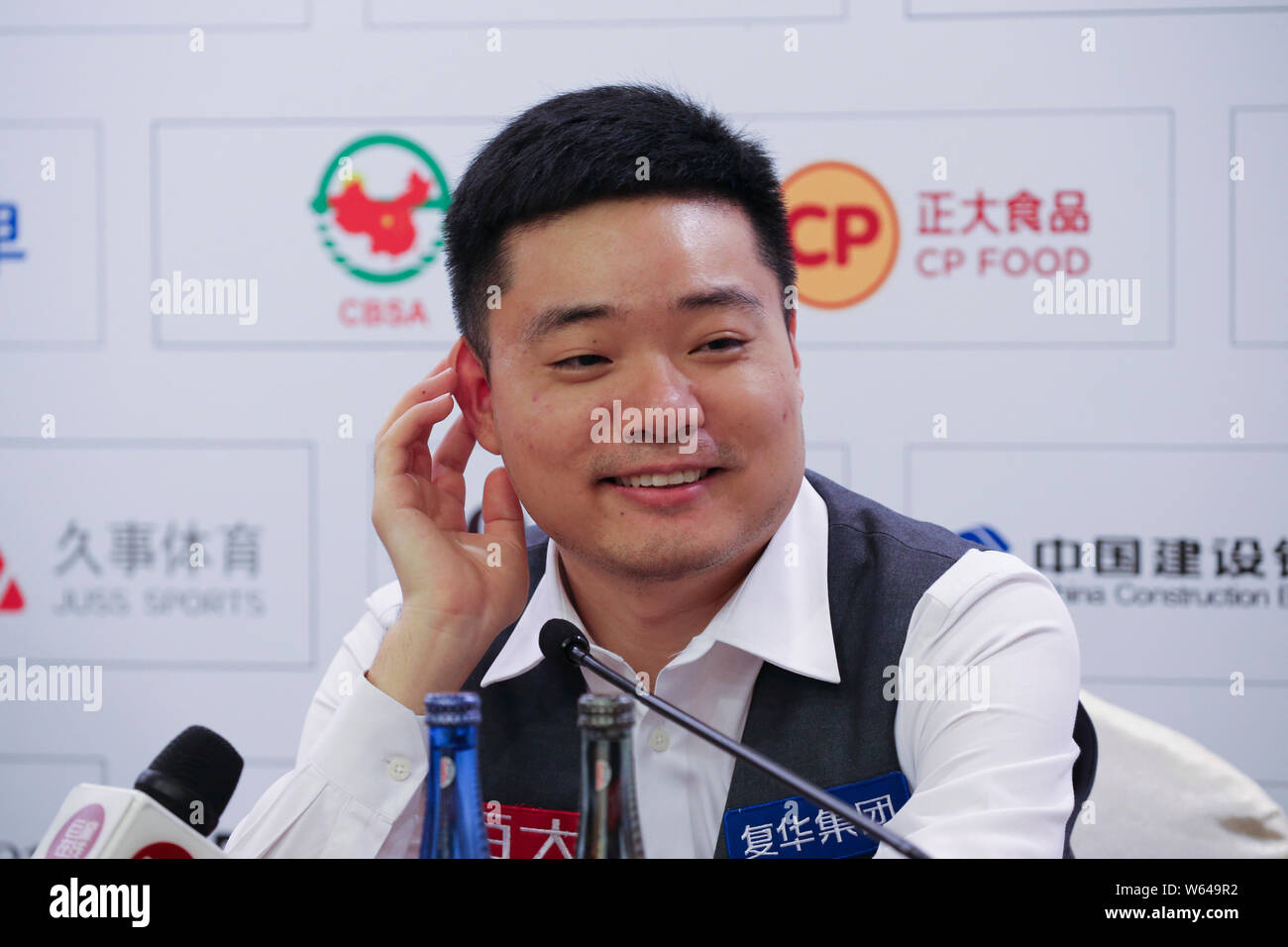 Ding Junhui of China attends a press conference after defeating Mark ...
