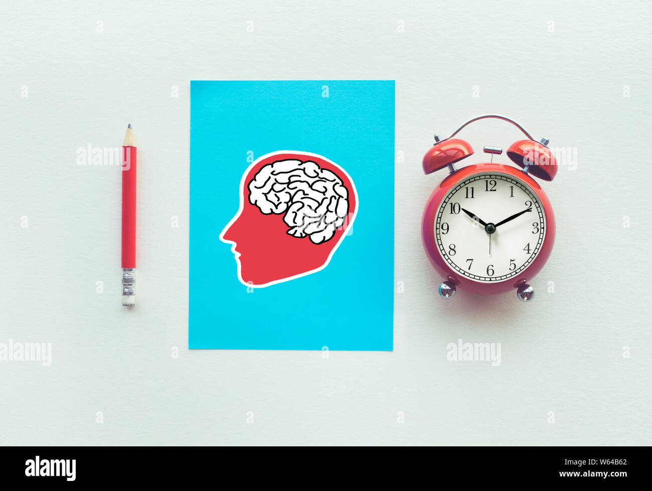 Performance concepts with pencil and brain sign drawing and alarm clock ...