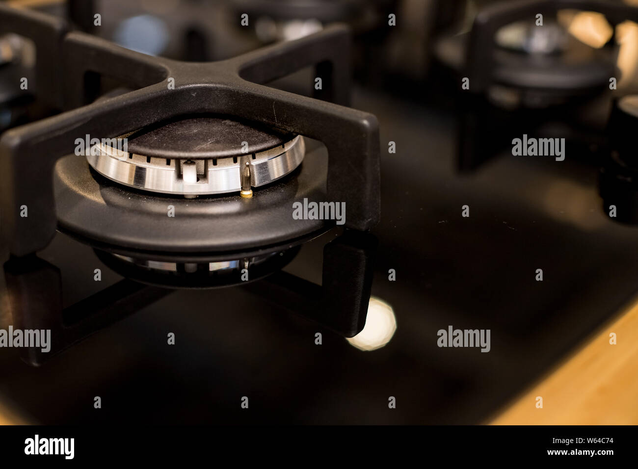 Modern stove in kitchen. Gas burner on a metal stove with control ...