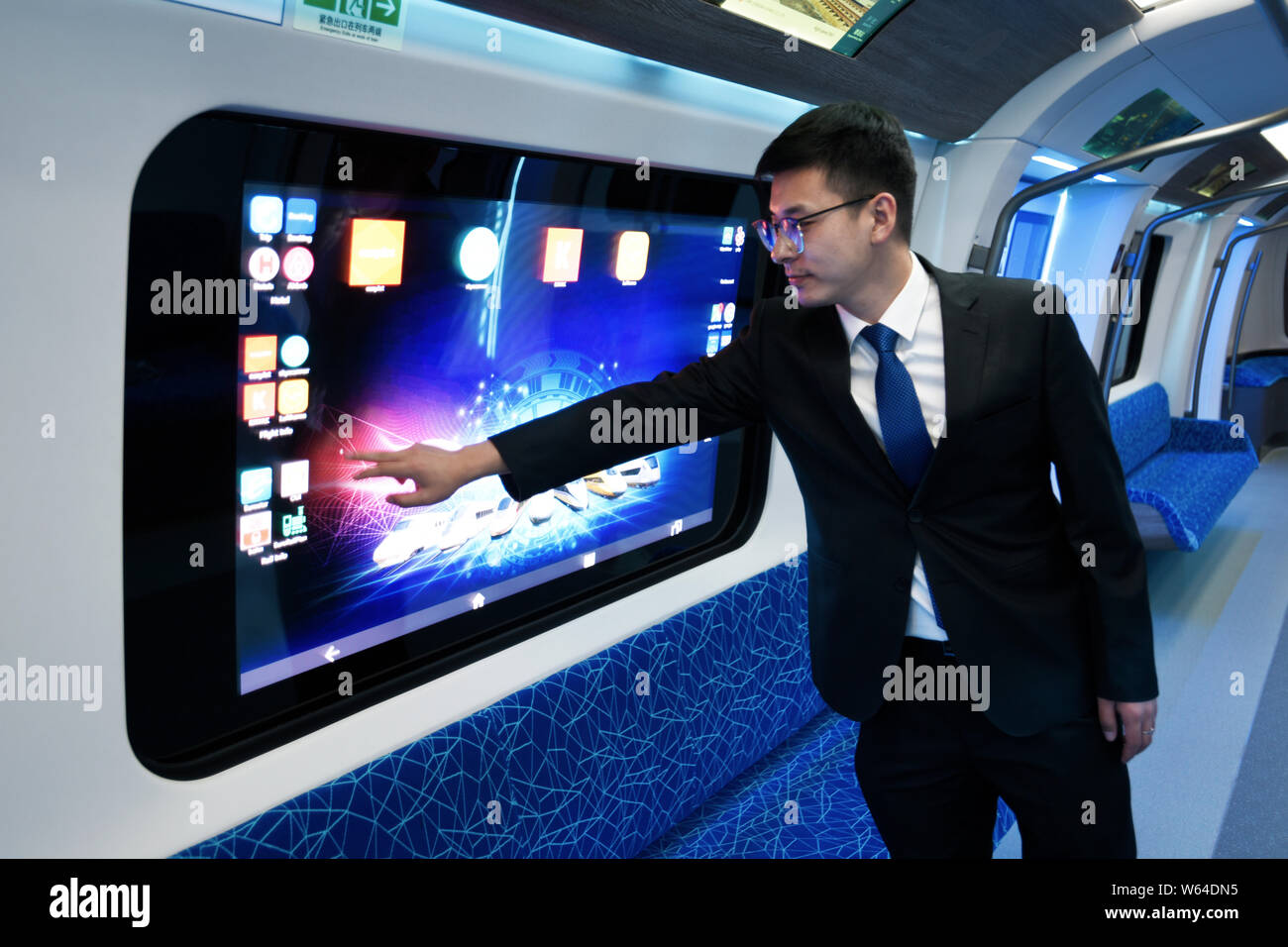 --FILE--A Chinese worker introduces a new generation carbon fiber metro ... --FILE--A Chinese worker introduces a new generation carbon fiber metro ...