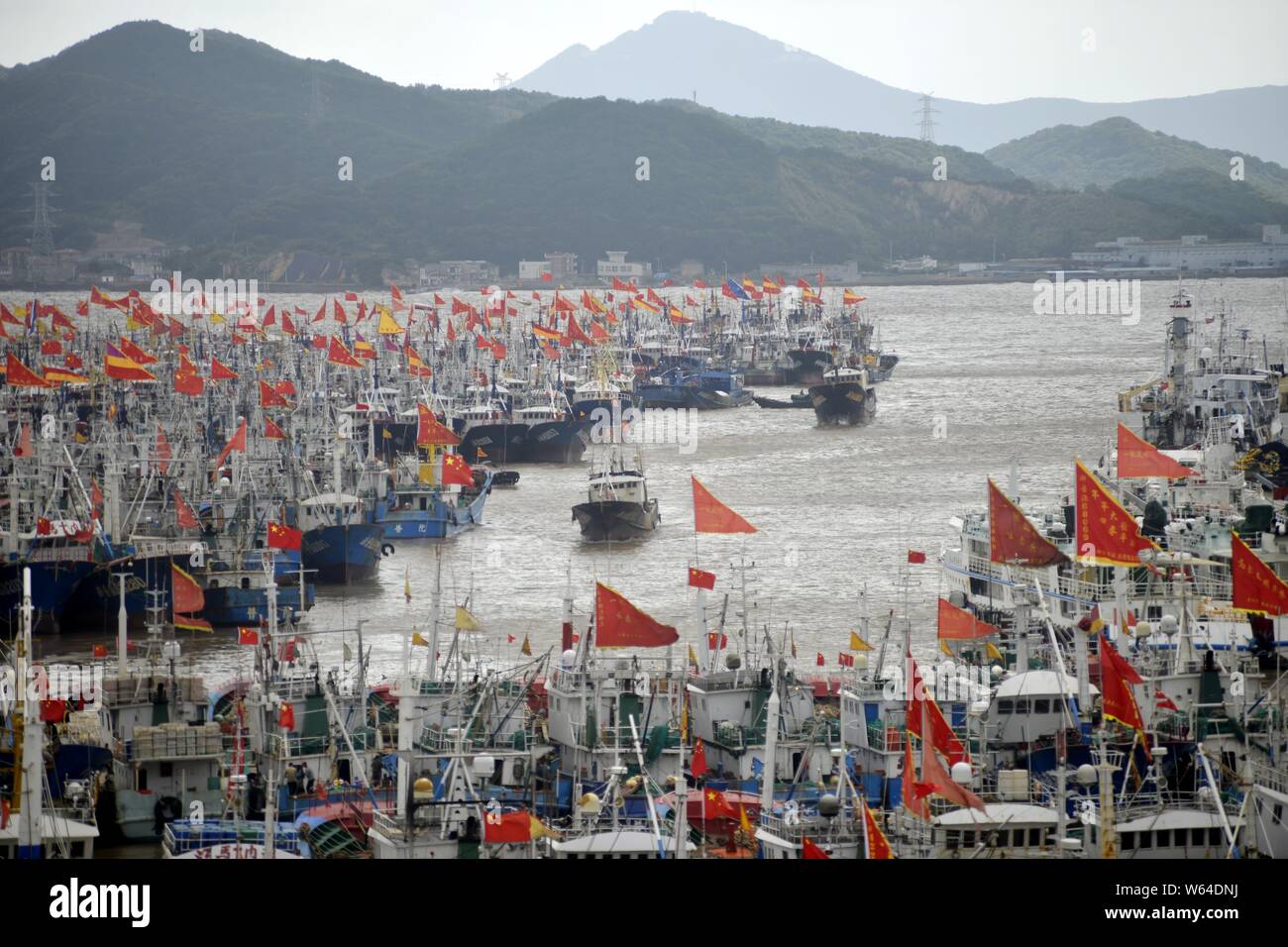 Chinese national flags flutter on fishing boats to celebrate the ...