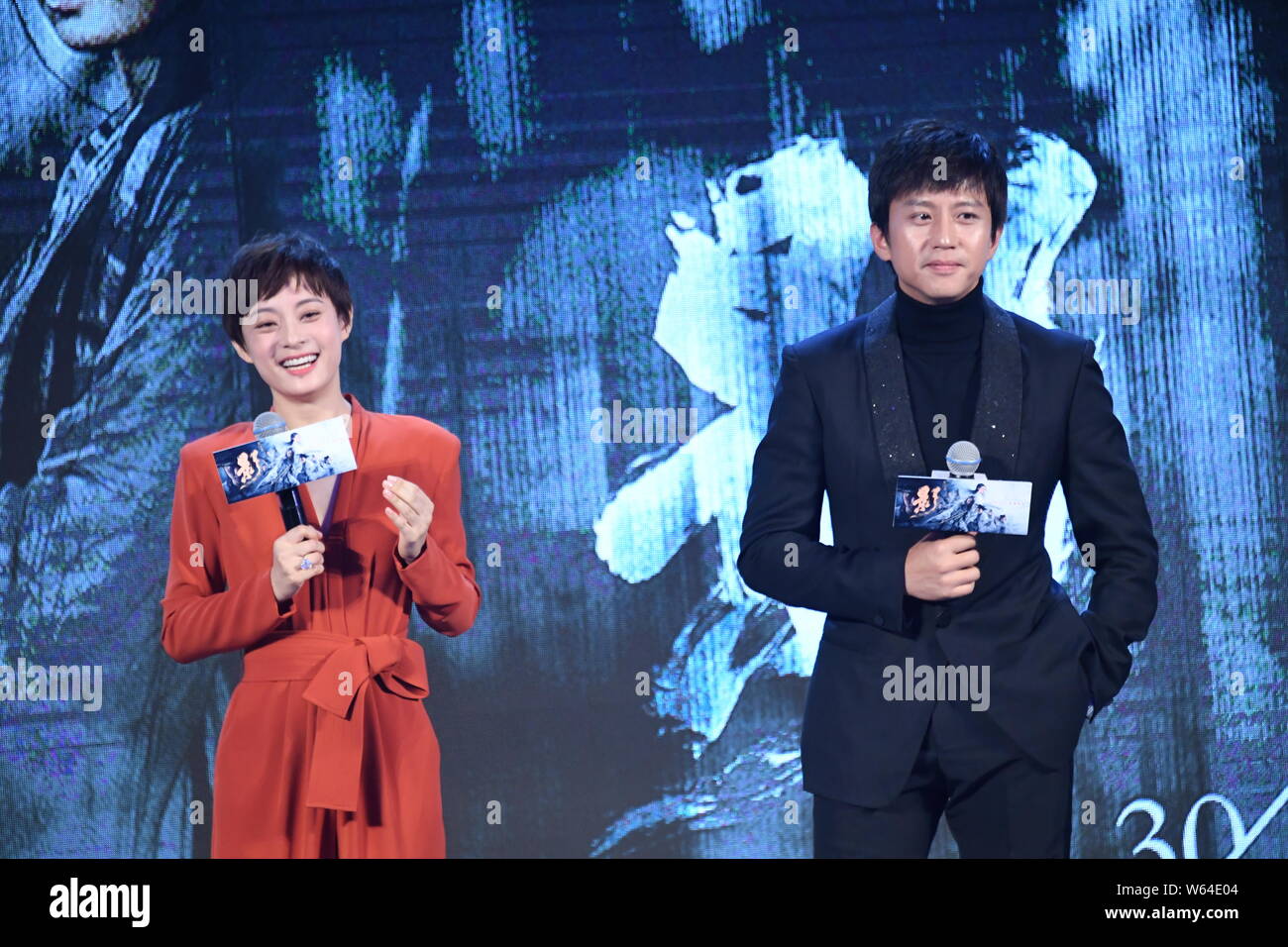 Chinese actress Sun Li, left, and her actor husband Deng Chao attend a ...