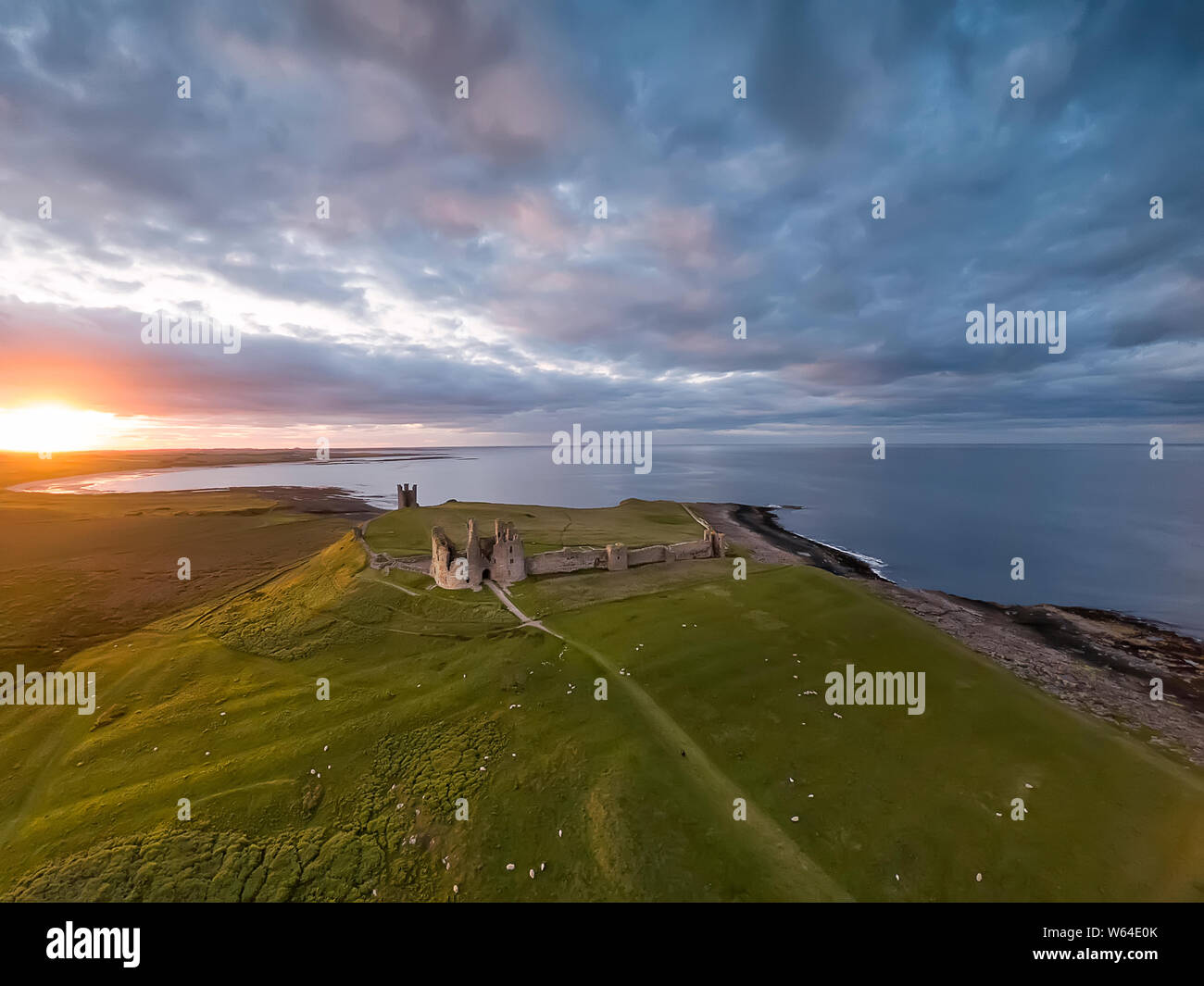 View from the air to Embleton bay, North sea, the cliff, ruins and ...