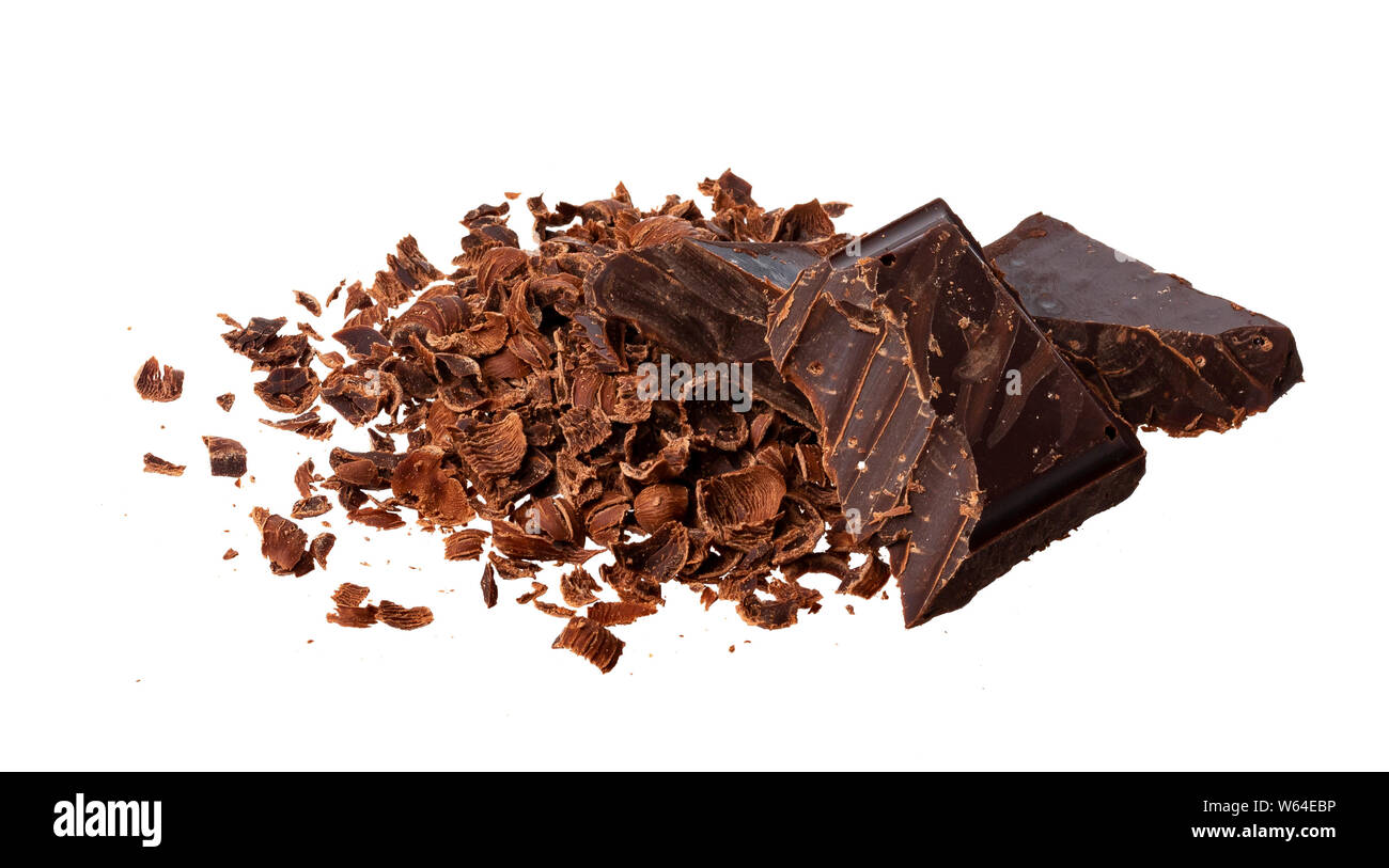 Broken chocolate. Heap of ground and grated chocolate isolated on white ...