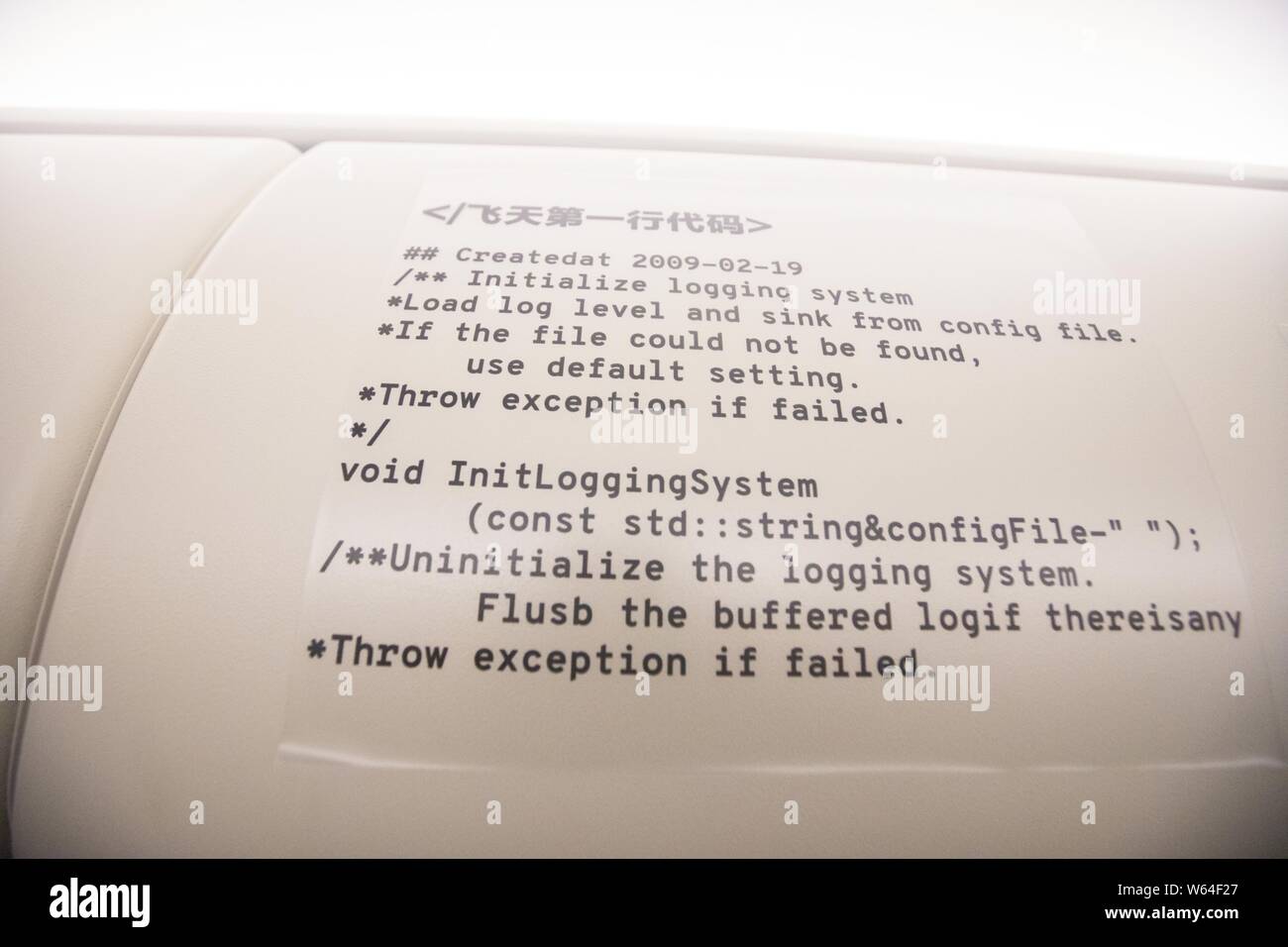 Computer program codes are displayed on on luggage rack cover onboard ...
