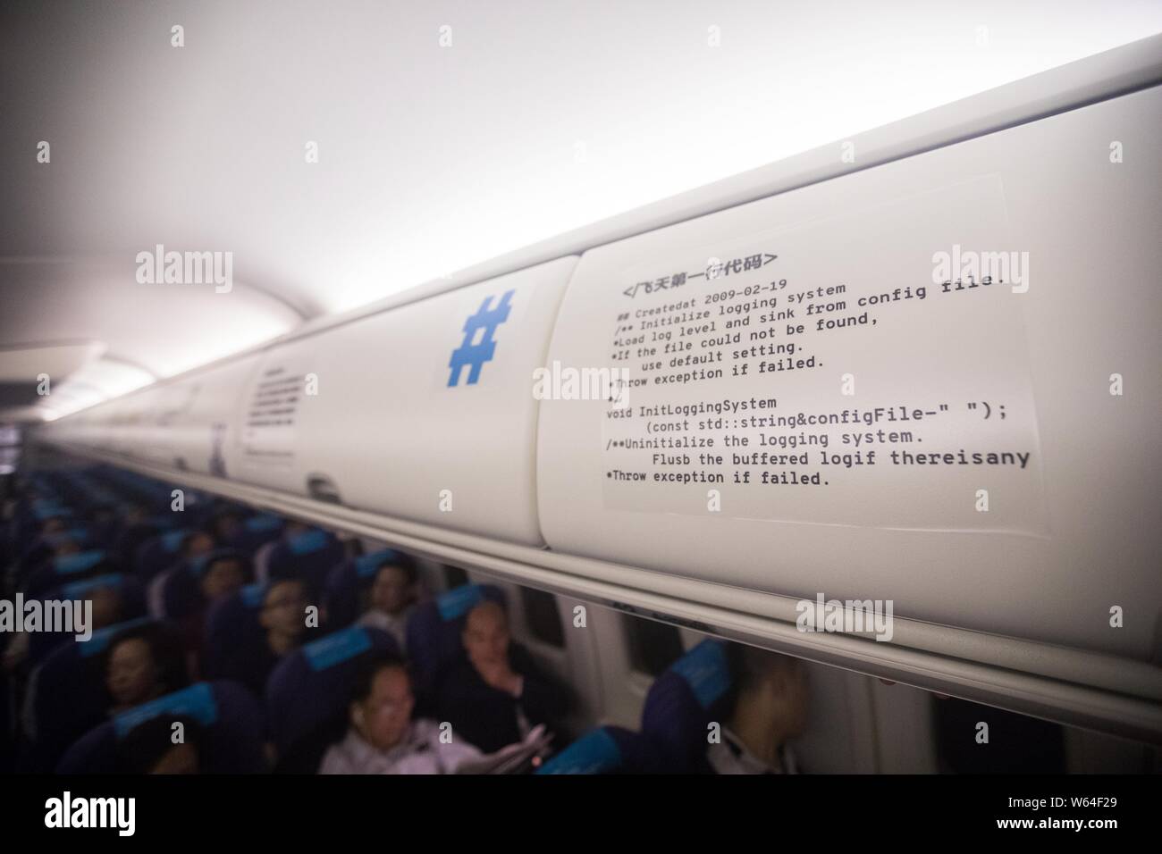 Chinese passengers are seen onboard Flight CZ6163 from Beijing to ...