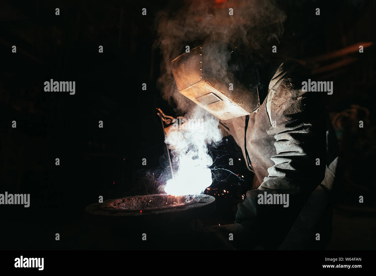Industrial Worker at the factory welding closeup Stock Photo - Alamy
