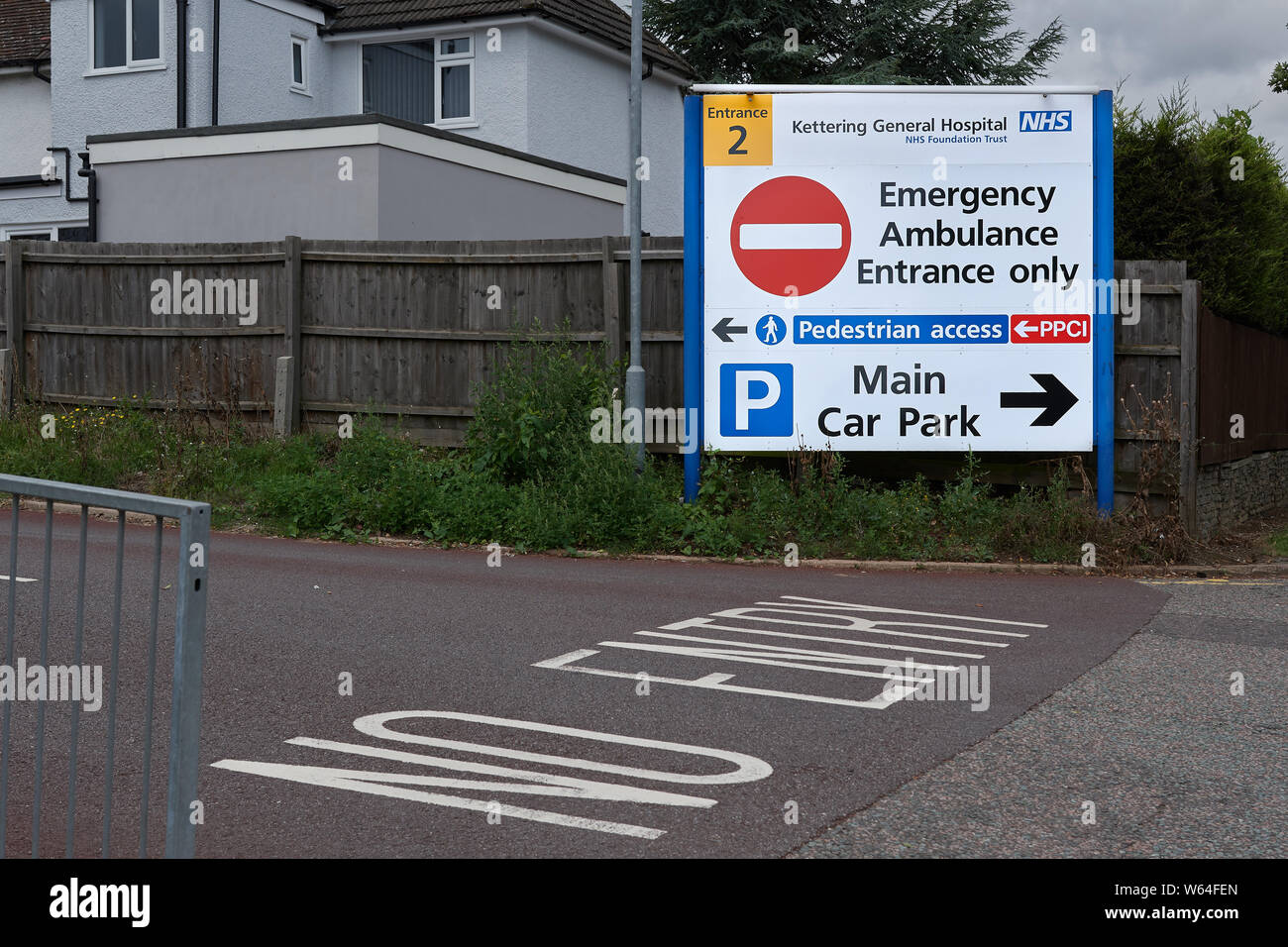 Sign outside entrance 2 of the NHS general hospital at Kettering ...