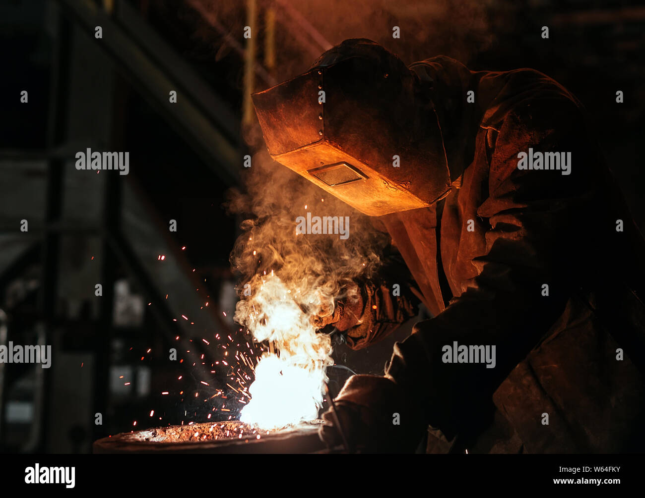 Industrial Worker at the factory welding closeup Stock Photo - Alamy