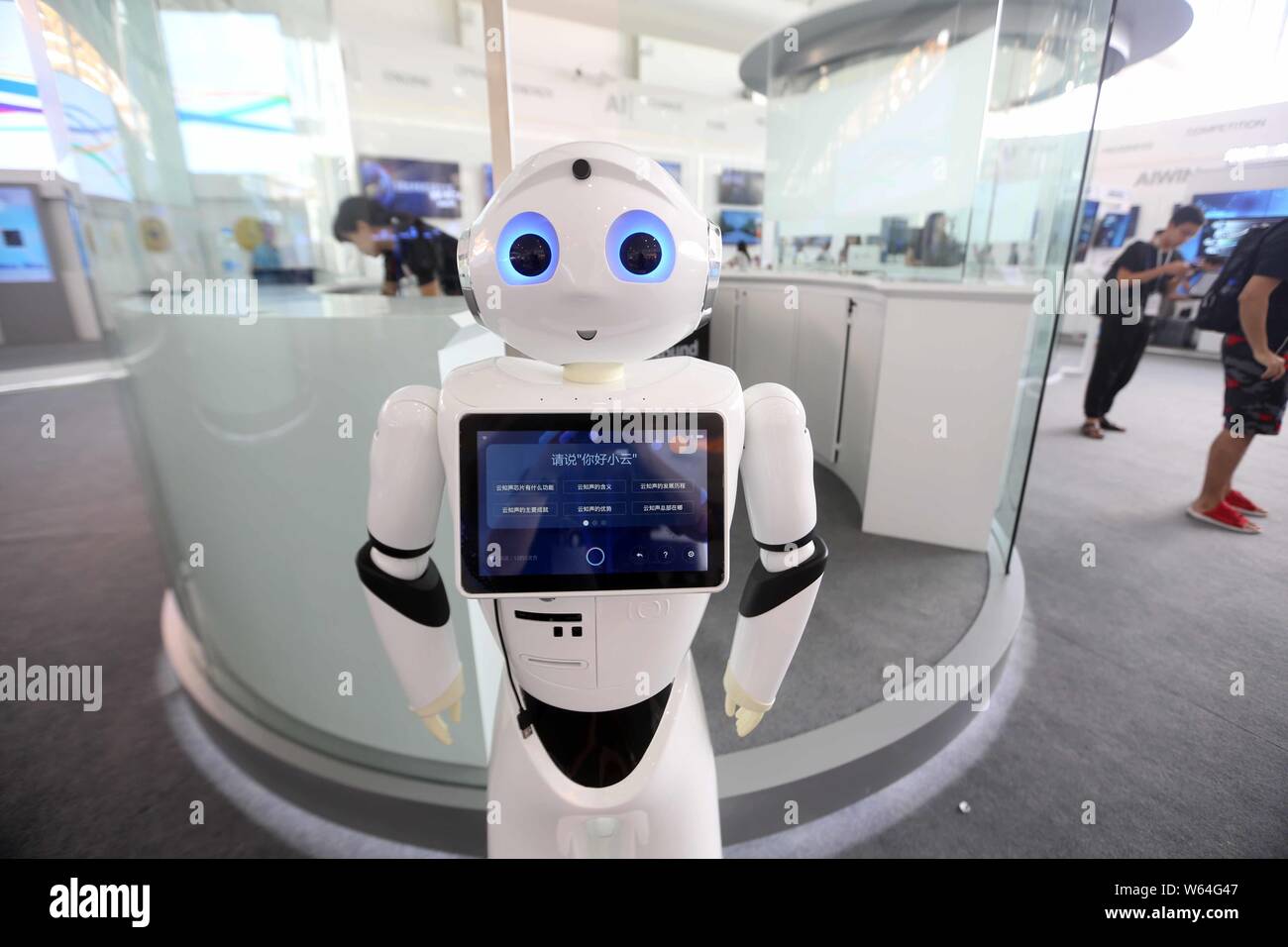 A service robot is on display before the 2018 World Artificial ...