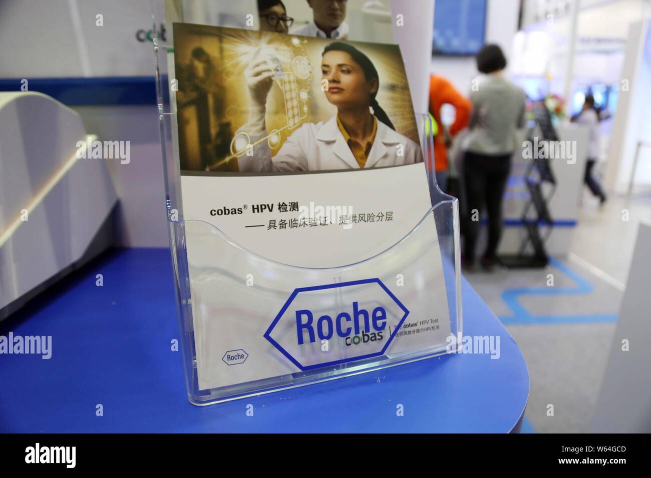 --FILE--People visit the stand of Roche during an exhibition in ...