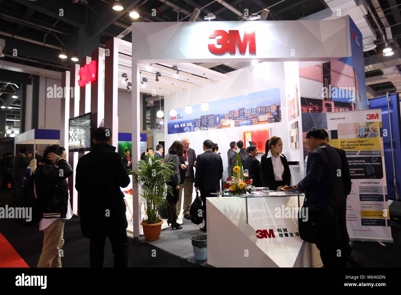 --FILE--People visit the stand of 3M Company during an exhibition in ...