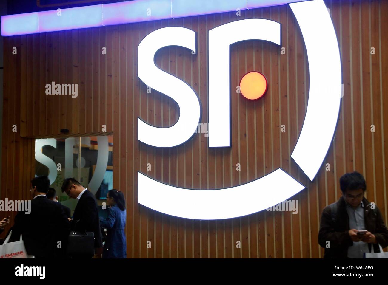 --FILE--People visit the stand of SF Express during an exhibition in ...
