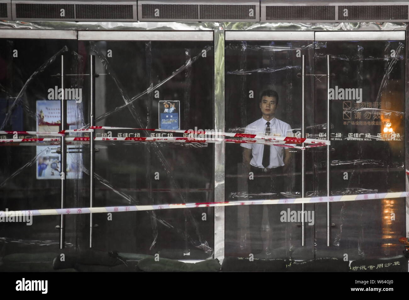 A security guard is seen a store which is in full preparation for ...