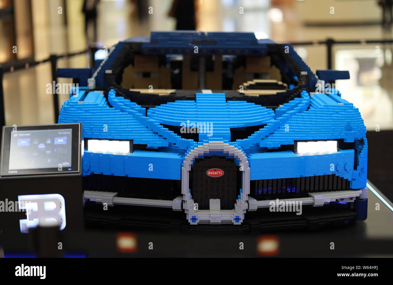 A Bugatti sports car made of 238,762 Lego bricks is on display at a ...