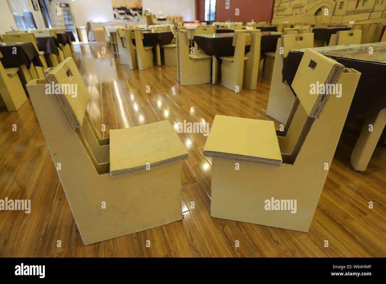 The corrugated fiberboard-made tables and chairs are displayed at the ...