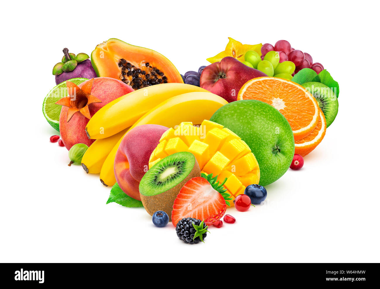 Heart shape made of fruits and berries isolated on white background ...