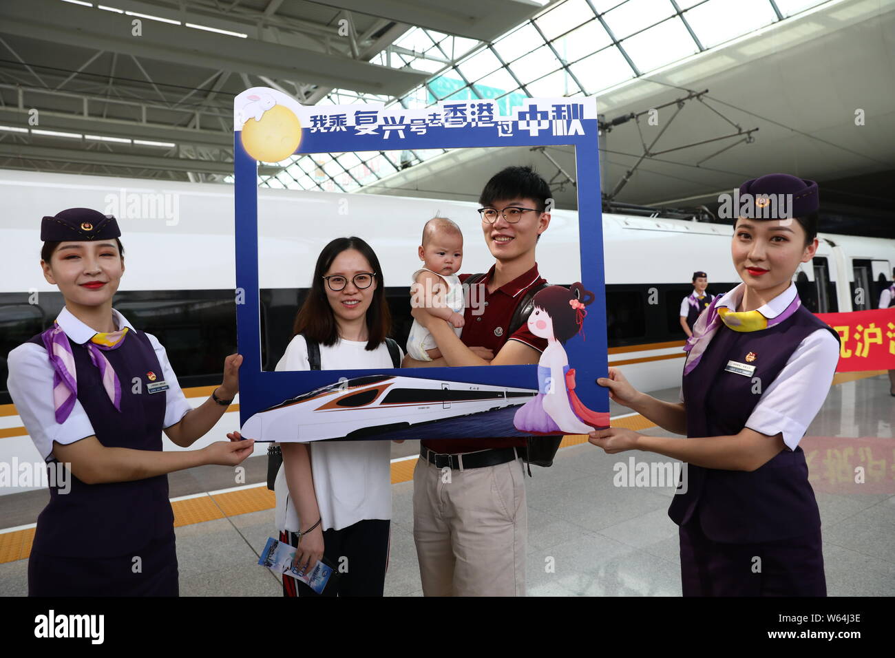 Passengers of train G99, the first high-speed train from Shanghai to ...