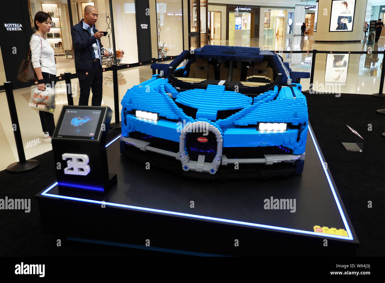 A Bugatti sports car made of 238,762 Lego bricks is on display at a ...