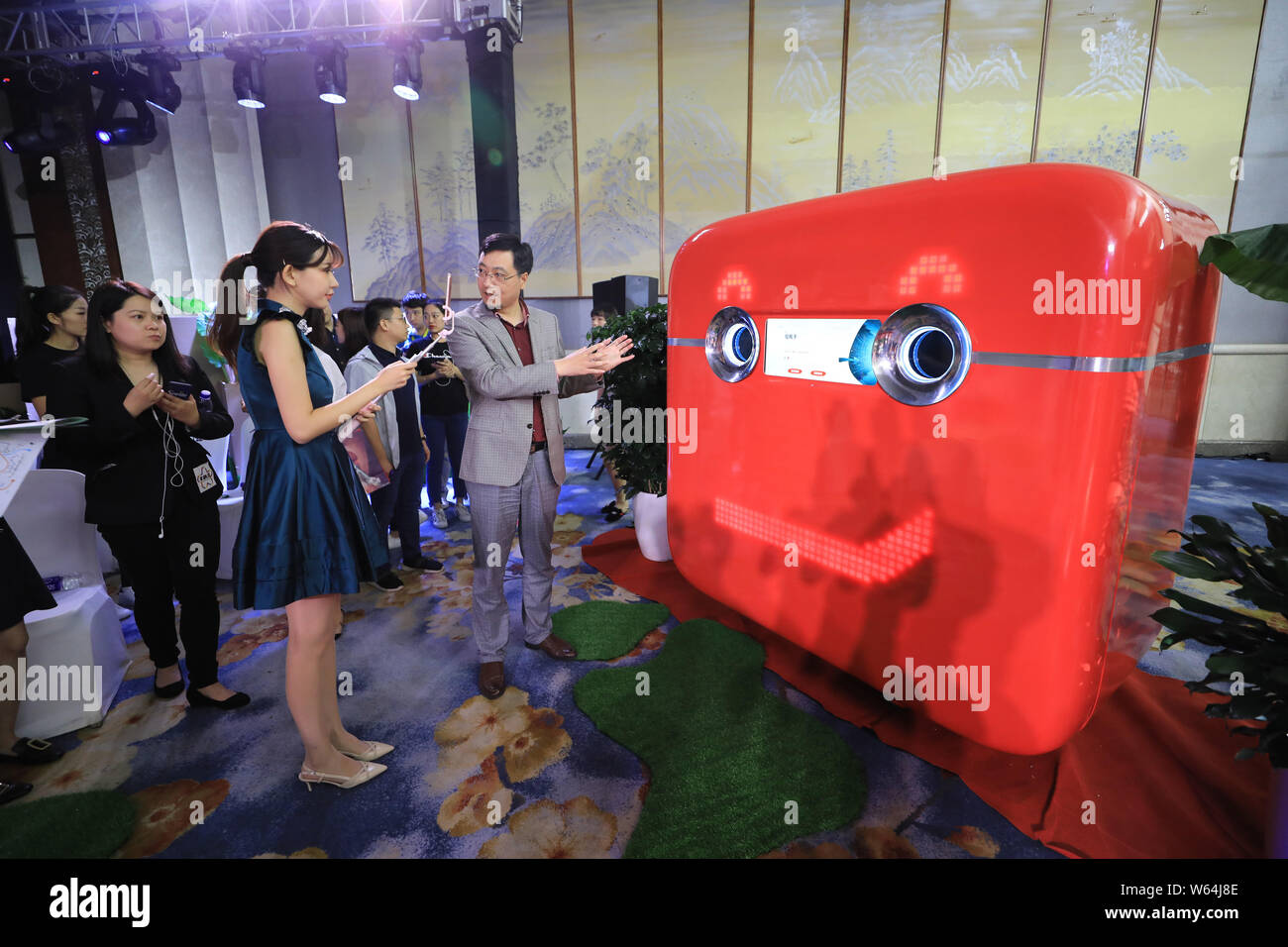A webcast hostess makes online live streaming webcasting as she tries ...