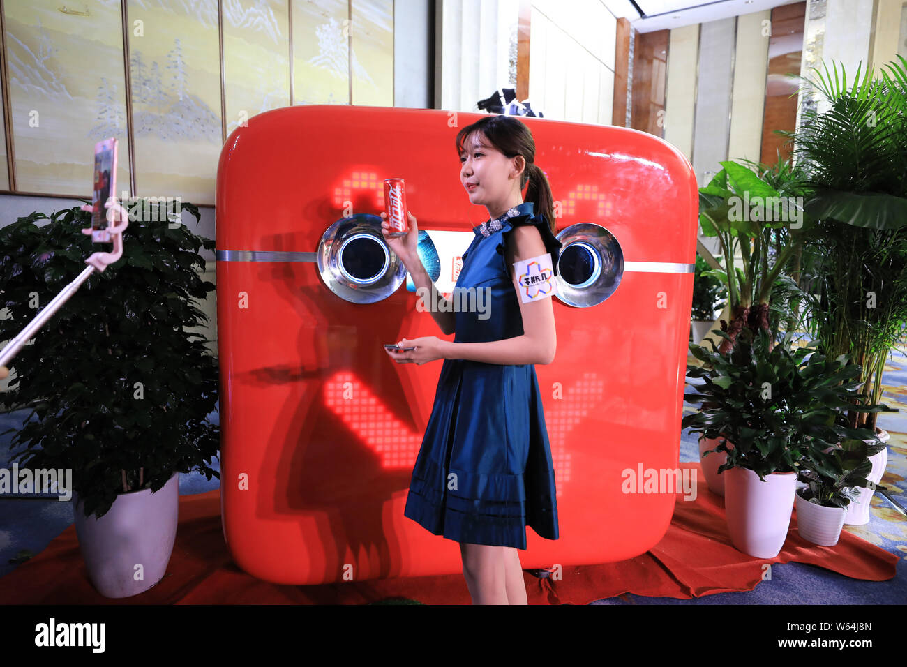 A webcast hostess makes online live streaming webcasting as she tries ...