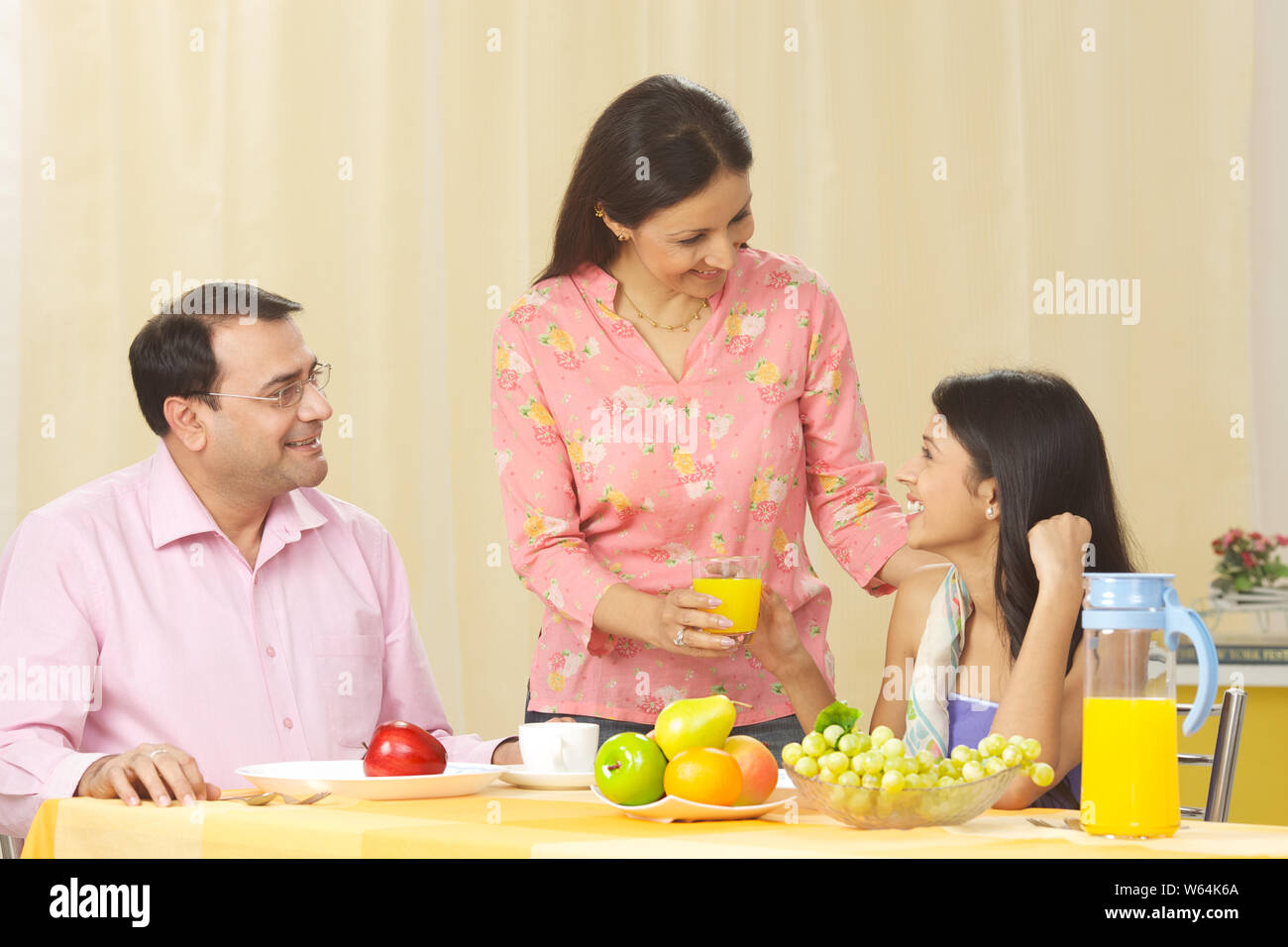 Adults family dining table hi-res stock photography and images - Alamy