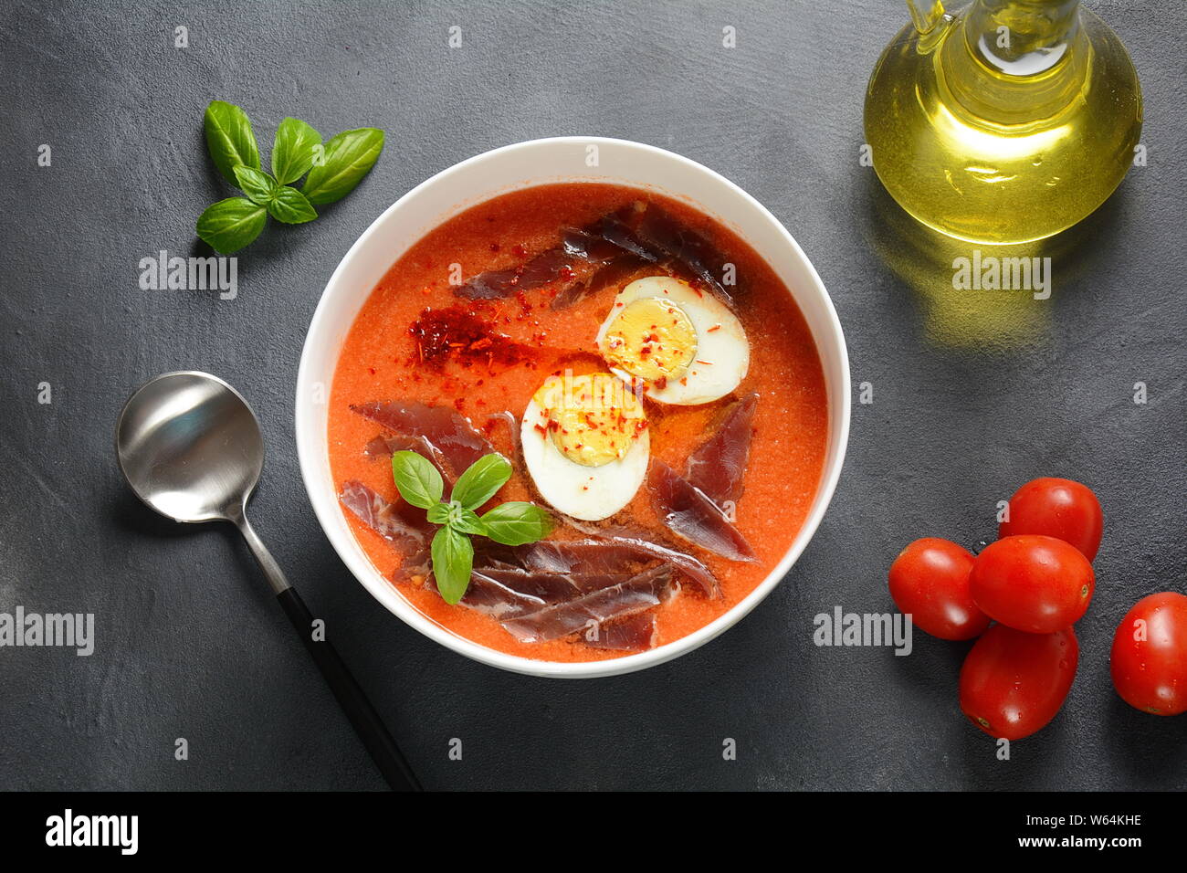 Traditional Spanish Andalusian tomato cream soup Salmorejo served with ...