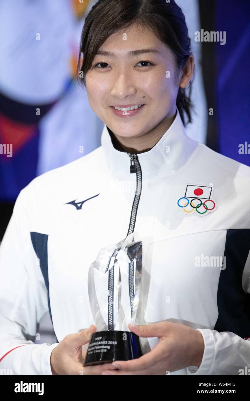 Japanese swimmer Rikako Ikee poses with the trophy after she was named ... Japanese swimmer Rikako Ikee poses with the trophy after she was named ...