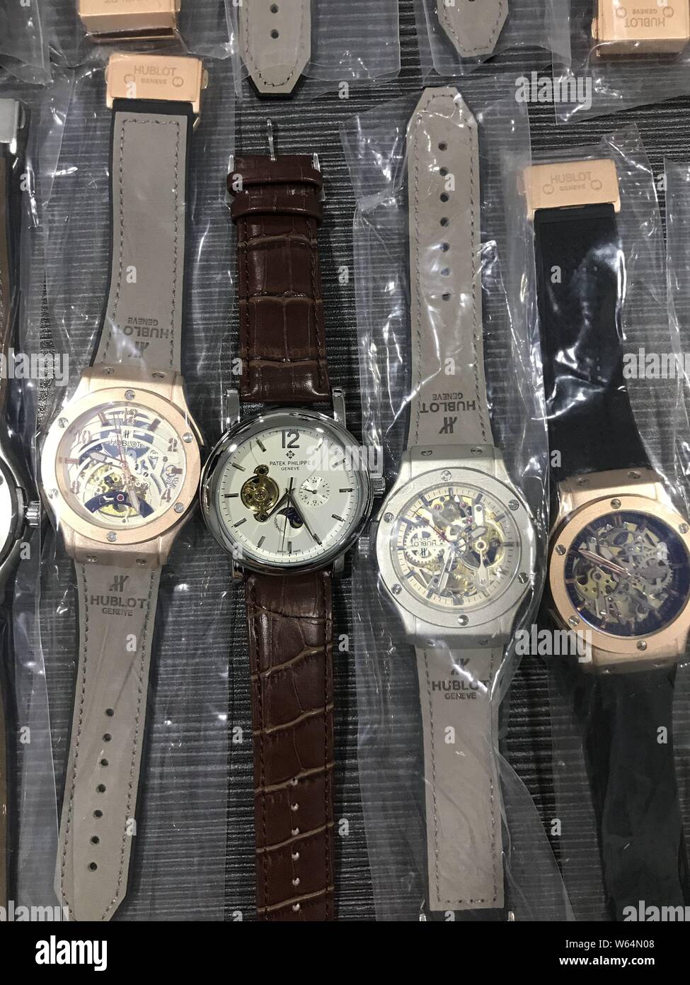 In this undated photo, counterfeit watches carried by a foreign woman ...