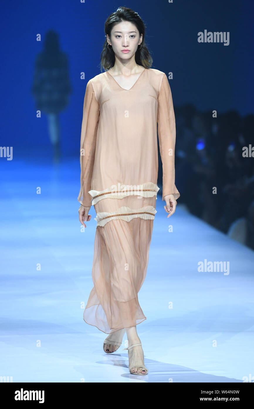 A model displays a new creation at the BIFU fashion show during the ...