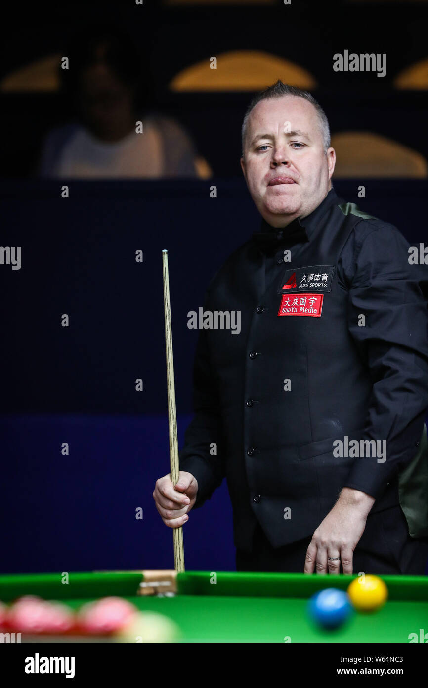 John Higgins of Scotland considers a shot to Ryan Day of Wales in their ...