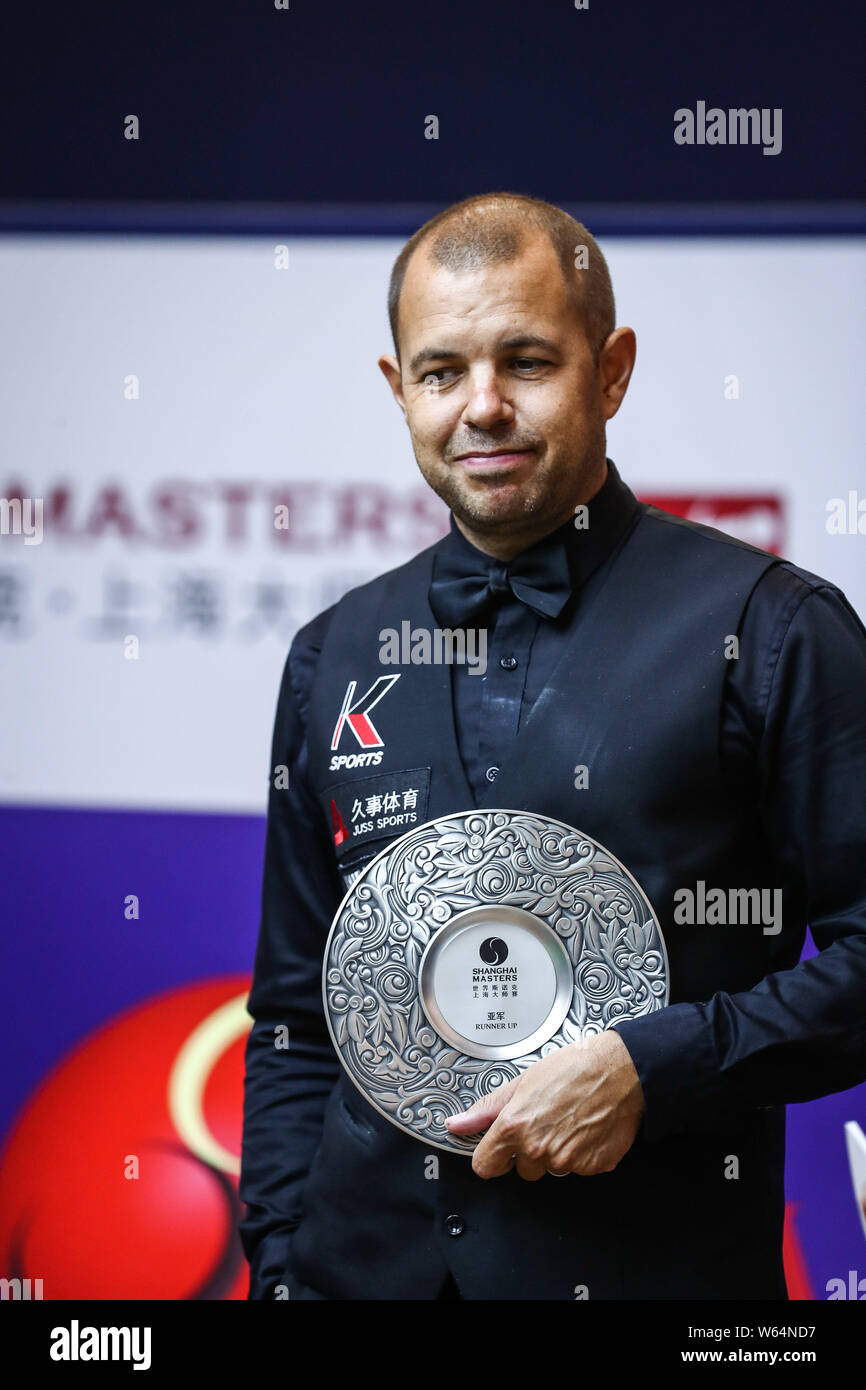 Barry Hawkins of England poses with his trophy after being defeated by ...