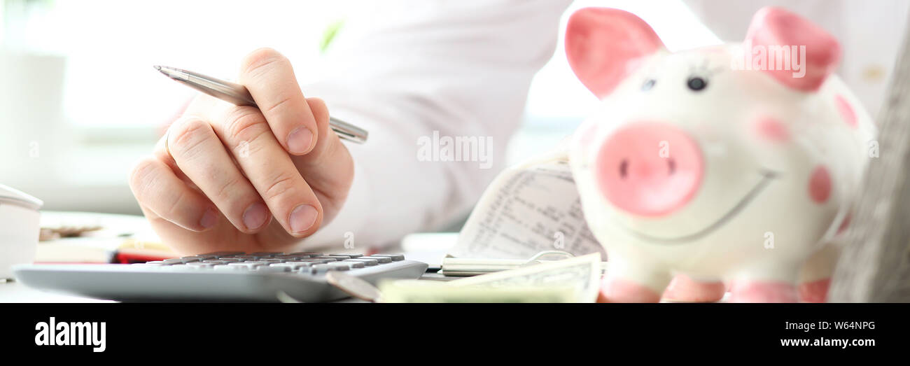 Hand of businessman counting something on calculator device Stock Photo ...