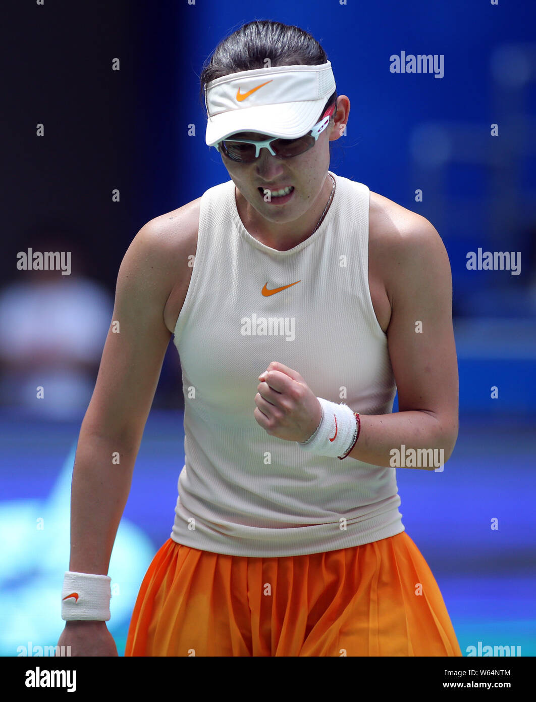 Zheng Saisai of China reacts after scoring against Danielle Collins of ...