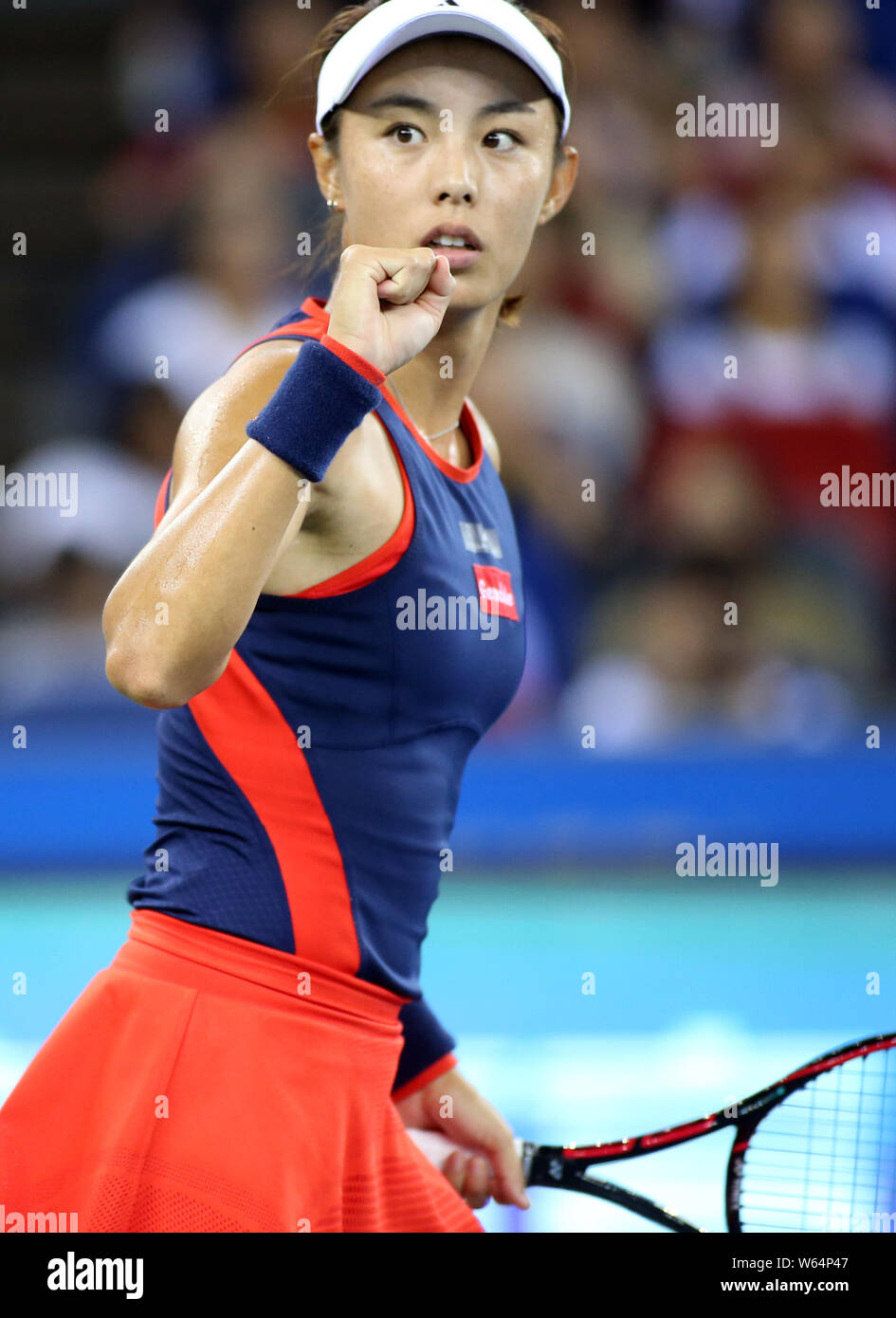 Wang Qiang of China reacts after scoring against Karolina Pliskova of Czech Republic in their ...