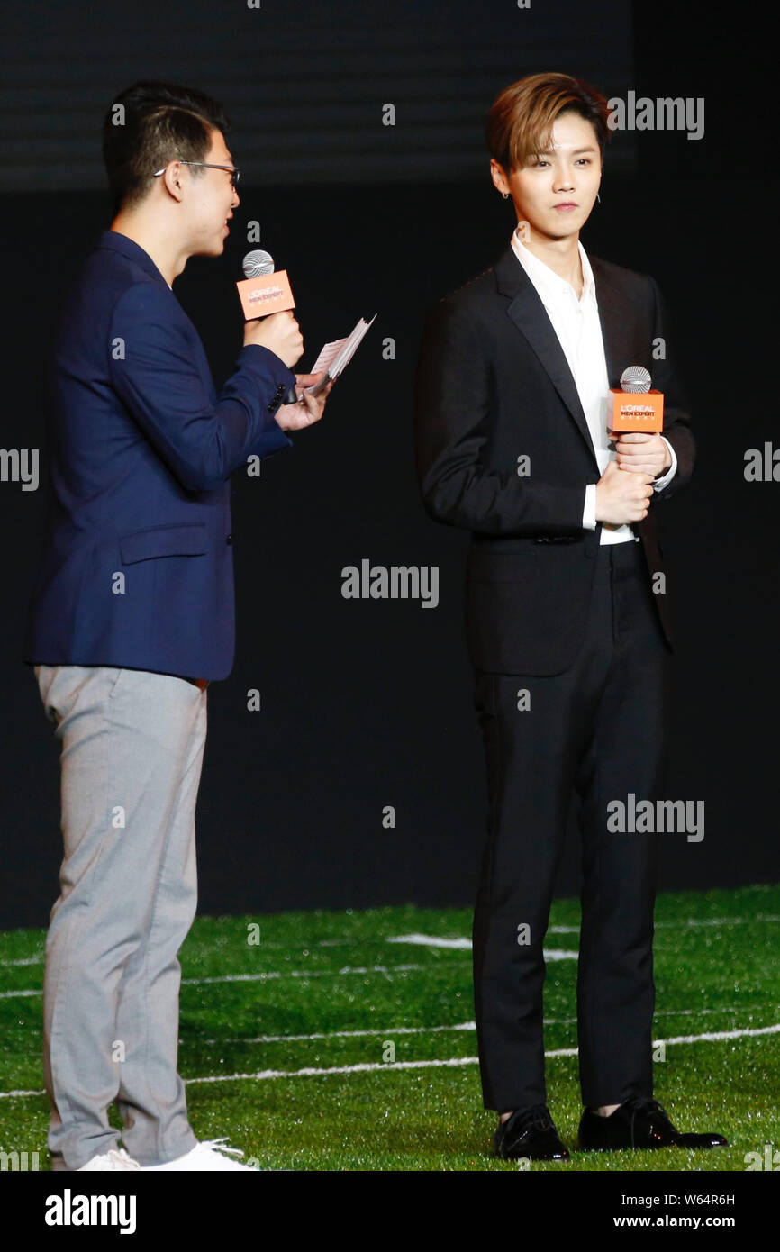 Chinese actor and singer Lu Han, right, attends the L'Oreal friendly ...