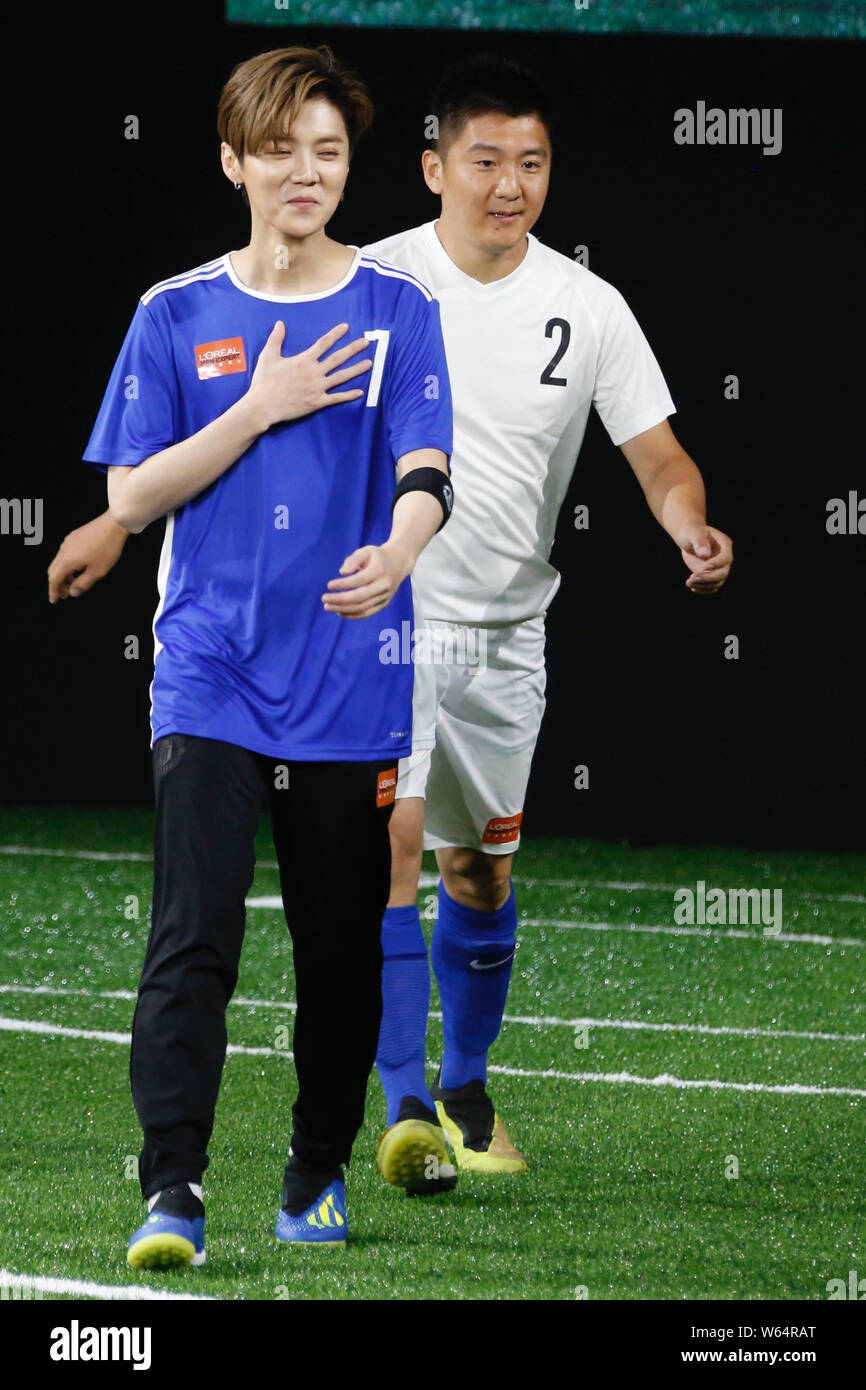 Chinese actor and singer Lu Han, left, attends the L'Oreal friendly ...