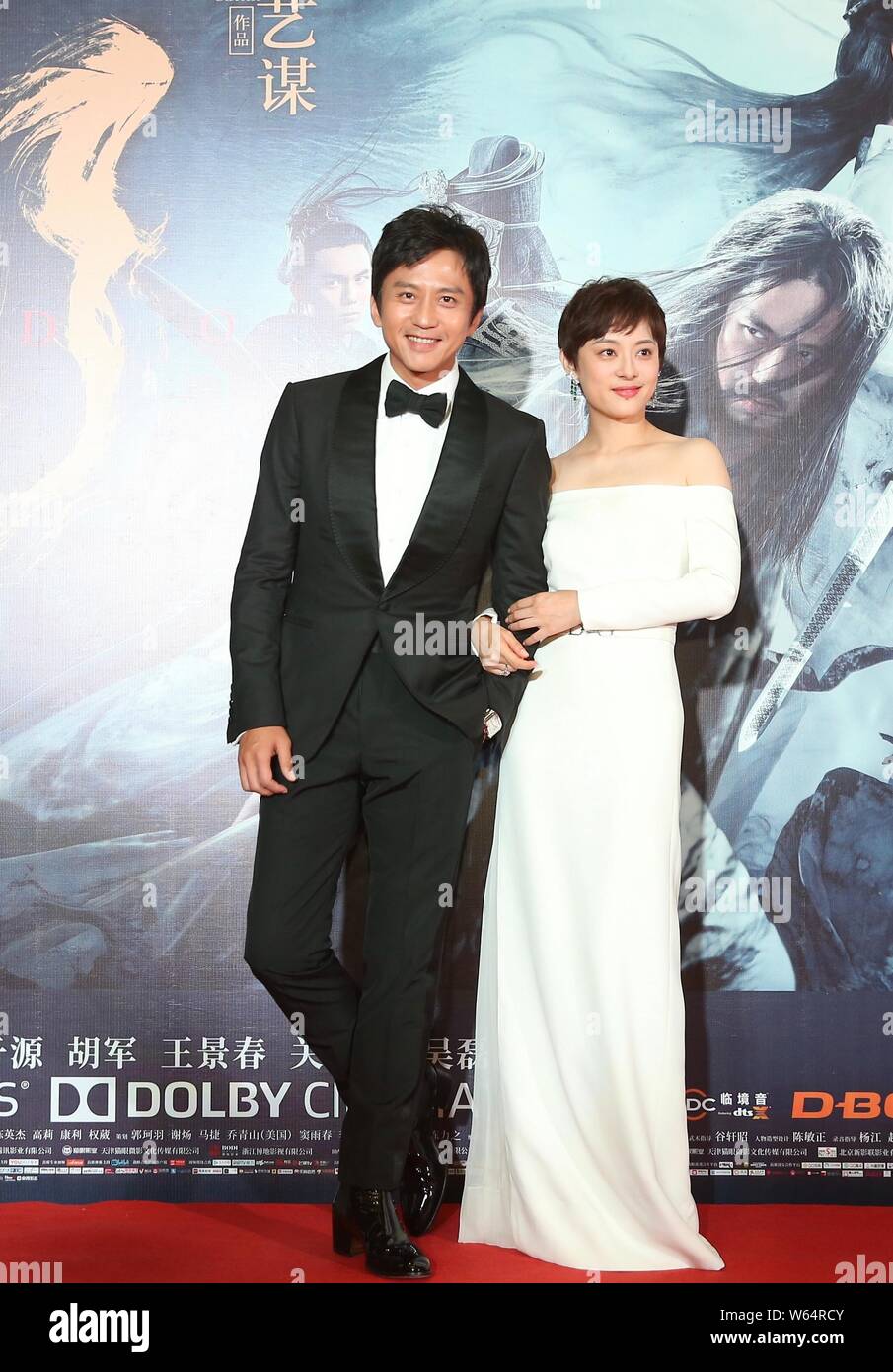 Chinese actress Sun Li, right, and her actor husband Deng Chao arrive ...