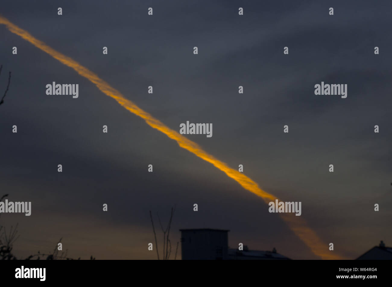 red contrail on sunset Stock Photo - Alamy