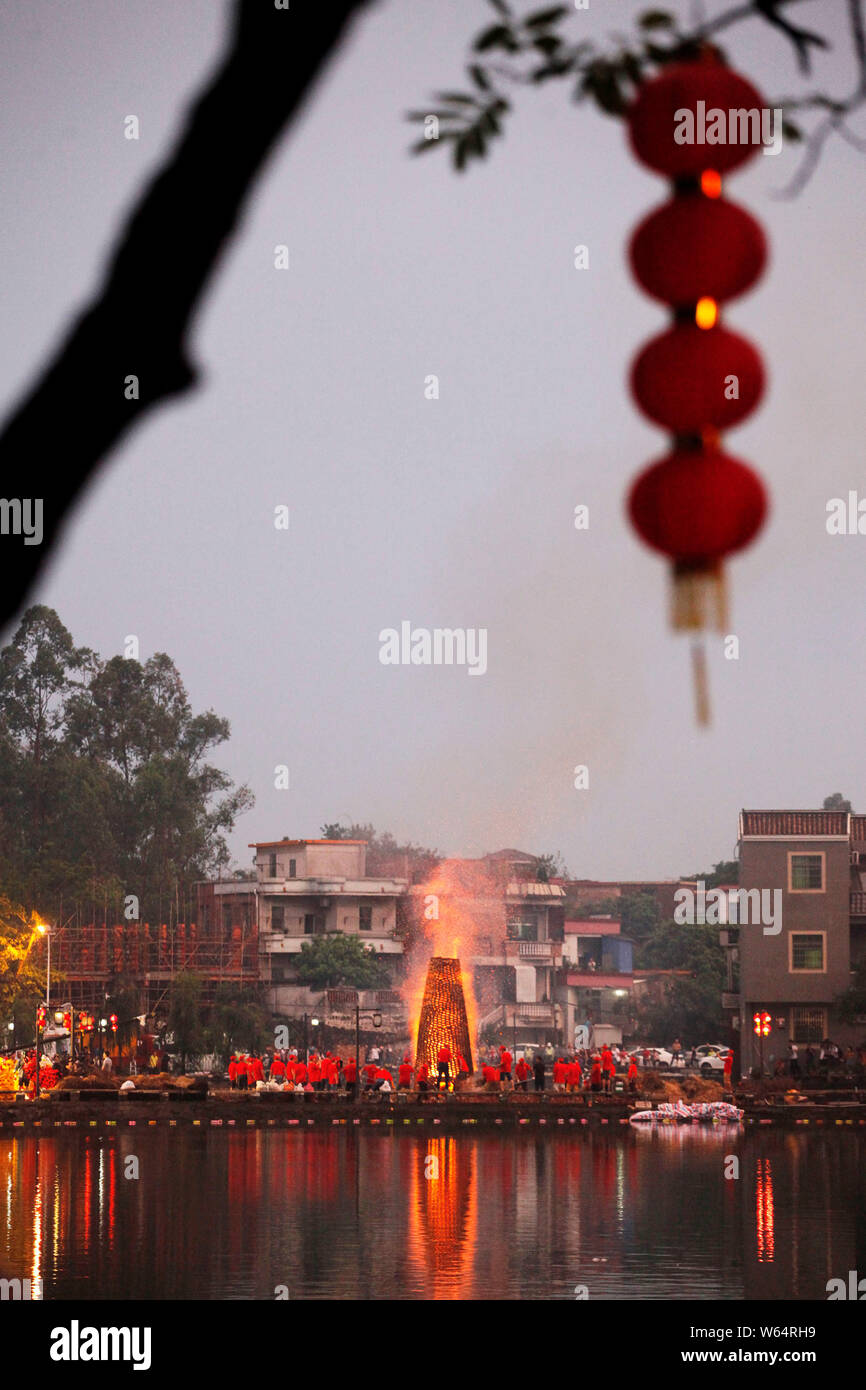A pagoda made of tile bricks is on fire to mark the Mid-Autumn Festival ...