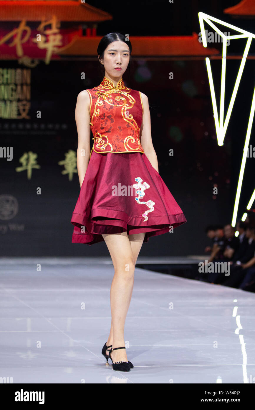 A model displays a traditional new creation during the China Intangible ...